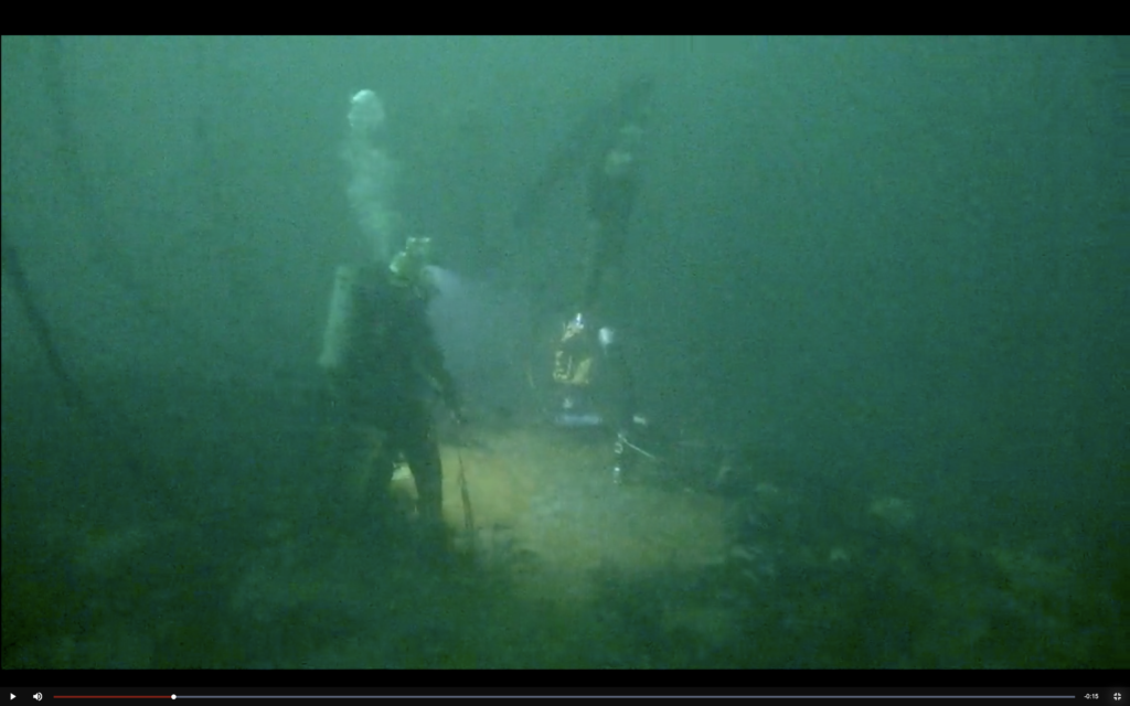 Deep-Water Diver Fits a Pumping System to Recover Oil from Shipwreck